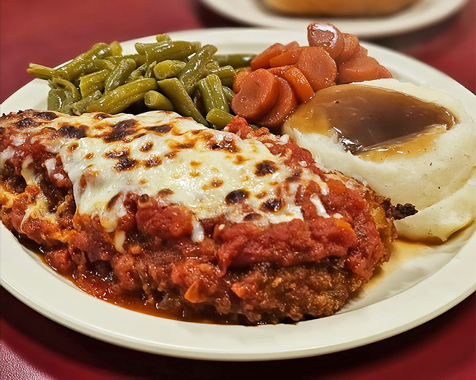 Comfort food doesn't stop at breakfast. This chicken parmesan with its blanket of melted cheese proves Mary Lou's dinner game is equally strong.