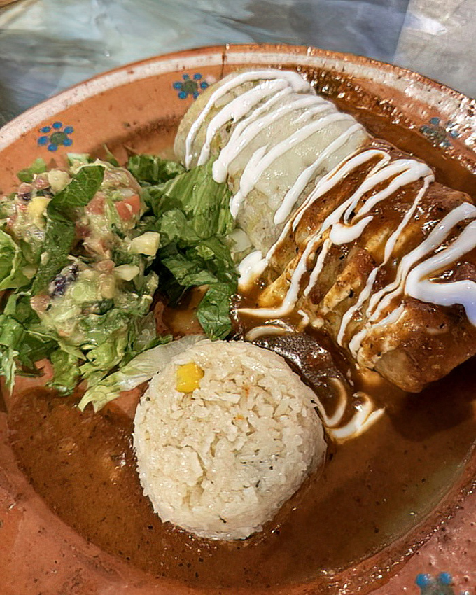 This burrito isn't just wrapped, it's embraced&mdash;a warm tortilla hugging savory fillings and swimming in a sauce so good you'll want to bottle it for emergencies.