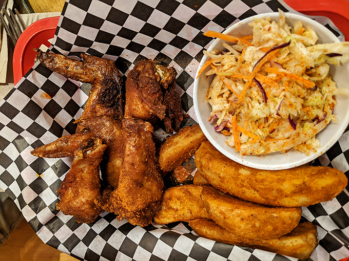 The perfect chicken wing trifecta&mdash;smoky, crispy, and juicy&mdash;served with slaw that cuts through the richness like a refreshing breeze.