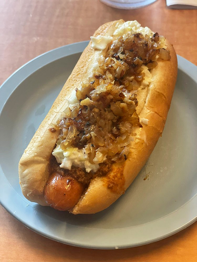 A hot dog topped with grilled onions and coleslaw is like a symphony where every instrument knows exactly when to play.