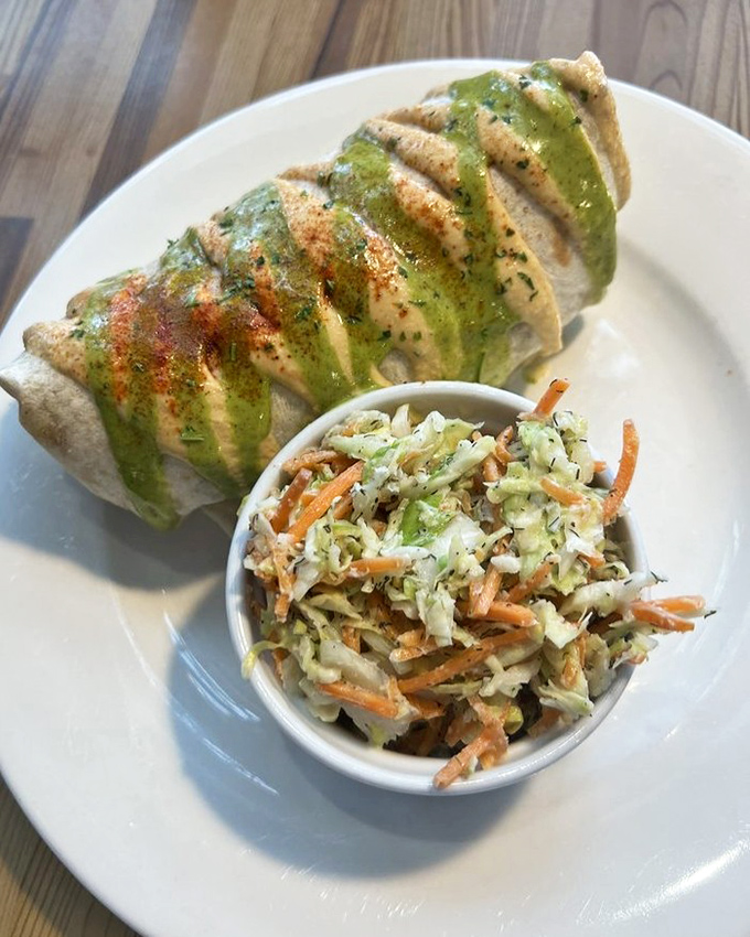 This isn't just a burrito&mdash;it's architecture. Perfectly wrapped with a vibrant green sauce that promises flavor fireworks with every bite.