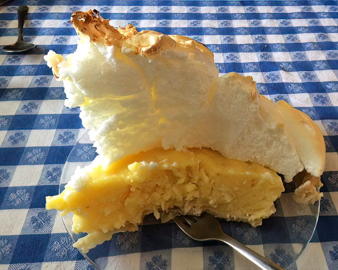 The coconut cream slice reveals its architectural wonder. That meringue-to-filling ratio isn't just impressive&mdash;it's practically showing off.