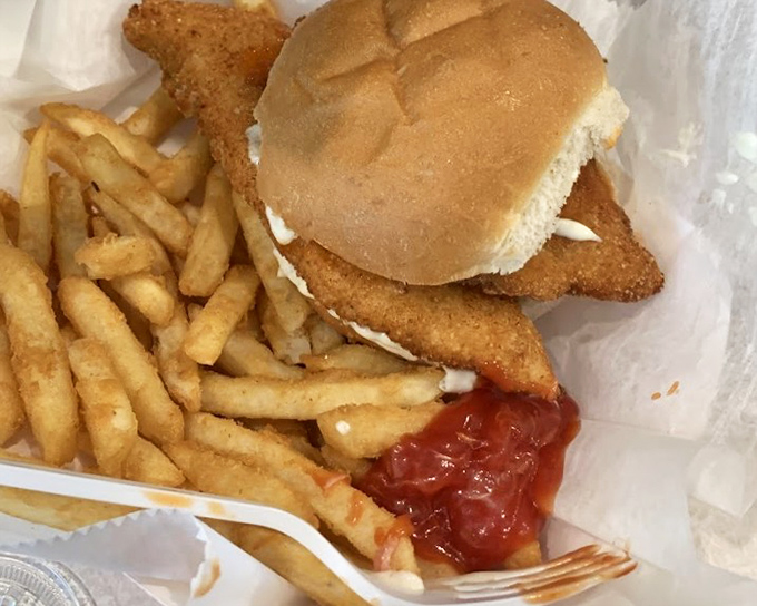 The fish sandwich and fries combo that's fueled Pittsburgh for generations. Notice how the fish rebelliously refuses to be contained by mere bread.