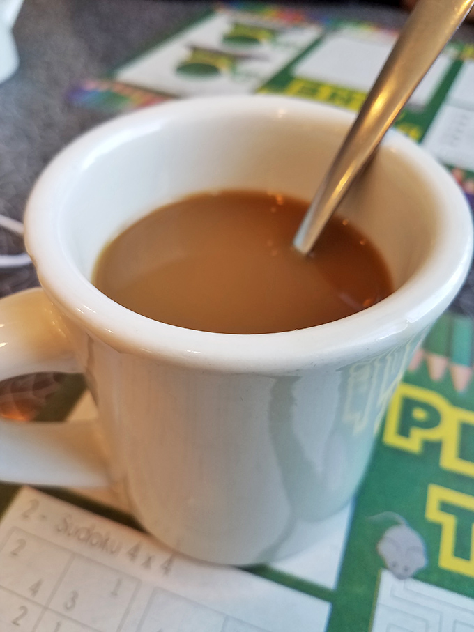 The humble coffee mug&mdash;unsung hero of American diners. This isn't artisanal pour-over in a ceramic vessel; it's liquid fuel for real conversation.
