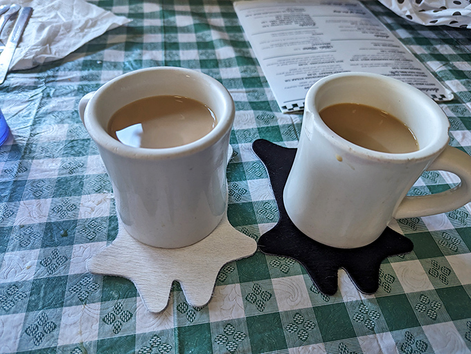 Those sturdy diner mugs don't just hold coffee—they cradle liquid motivation on star-shaped coasters.