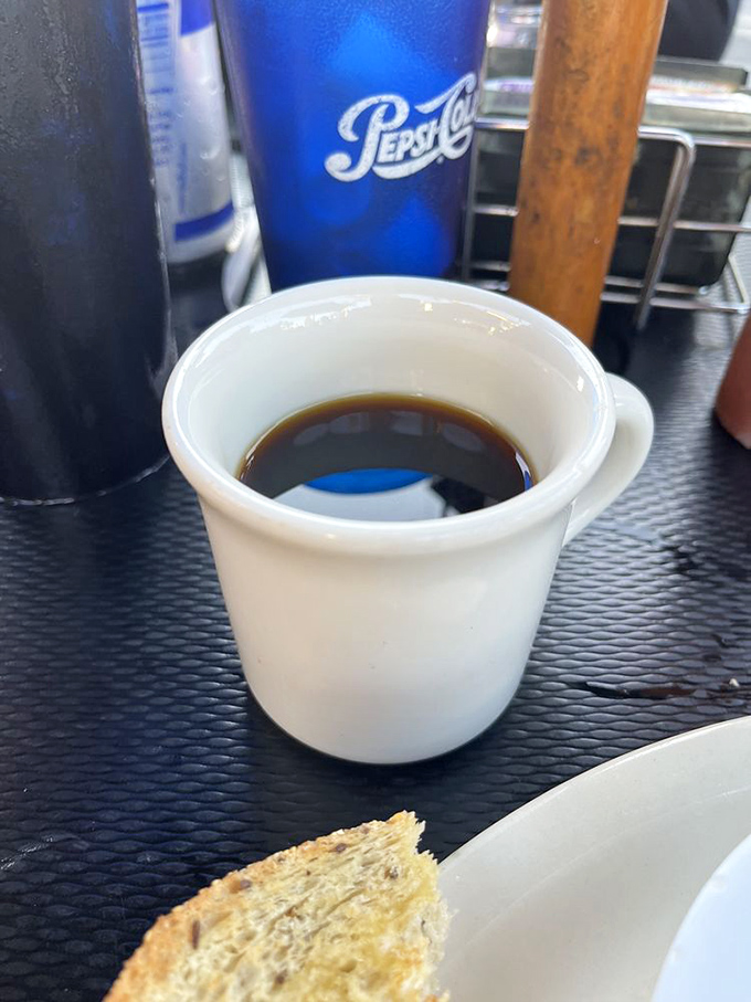 The humble coffee mug&mdash;unassuming yet essential companion to every great breakfast conversation. No fancy latte art needed when the coffee's this good.