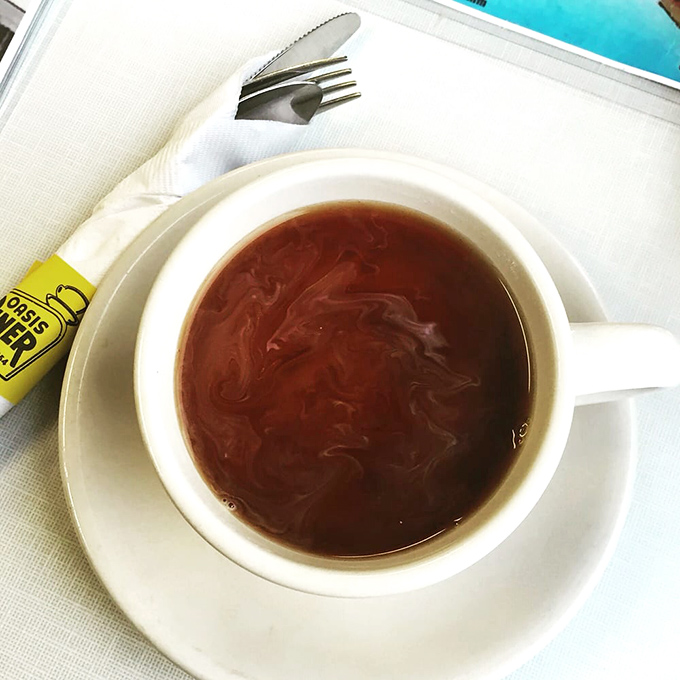 Coffee in a classic white mug&mdash;the lifeblood of diners everywhere, promising infinite refills and the gentle reminder that good things don't need to be complicated.