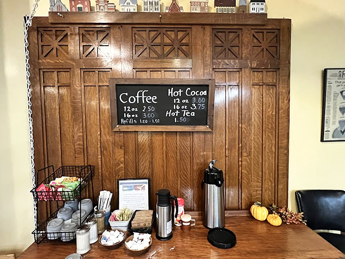 A self-service coffee station with seasonal decorations that says, "We trust you with hot liquids and also care about ambiance."