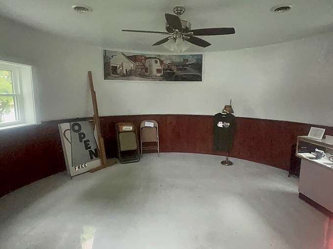 Step inside to discover the Coffee Pot's surprisingly spacious interior, where curved walls and wooden wainscoting create an unexpected coziness.