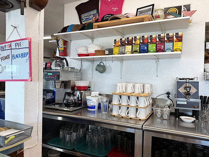 The coffee station stands ready for duty, like a caffeinated lighthouse guiding sleepy patrons to the shores of wakefulness.
