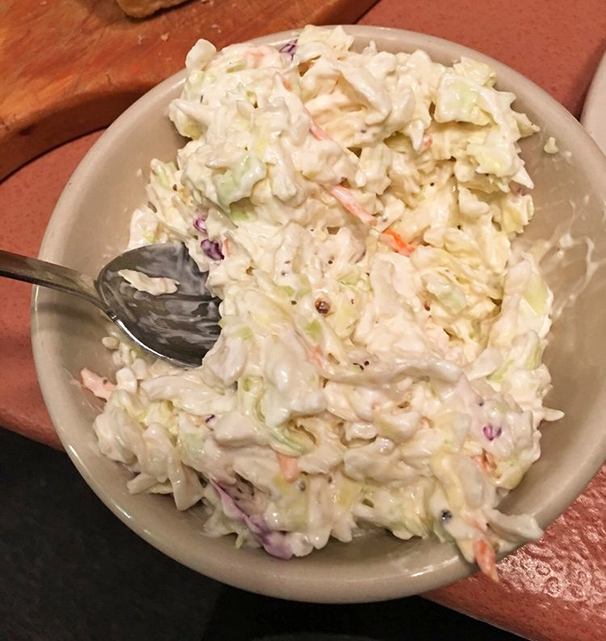 The coleslaw provides that perfect crisp counterpoint to all the warm comfort foods &ndash; a refreshing palate cleanser between bites of chicken.
