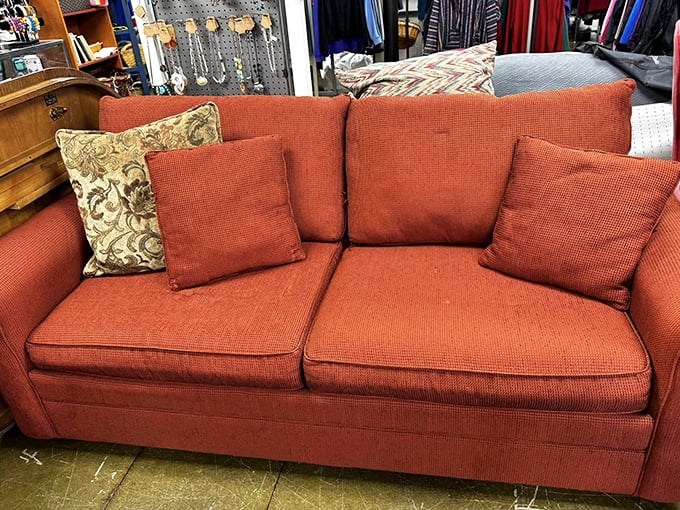 That coral couch has stories to tell but plenty of life left to give. Perfect for everything from Netflix marathons to unexpected naps.