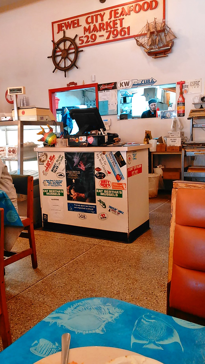 The market counter where seafood dreams begin. Behind that glass lies tomorrow's dinner and today's freshest catch, all waiting for their culinary destiny.