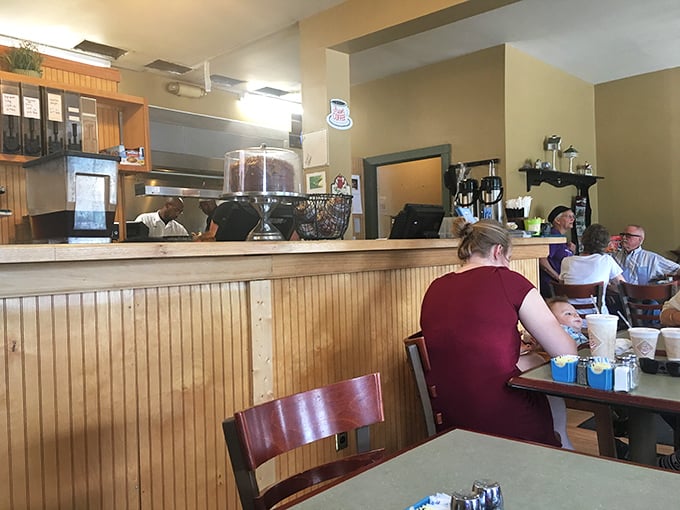 Another angle of the welcoming interior where wood paneling and comfortable seating invite you to stay awhile.