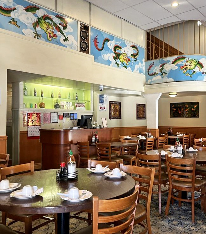 The two-story dining room combines function with festivity. Those dragon murals aren't just watching you eat&mdash;they're silently judging your chopstick technique.