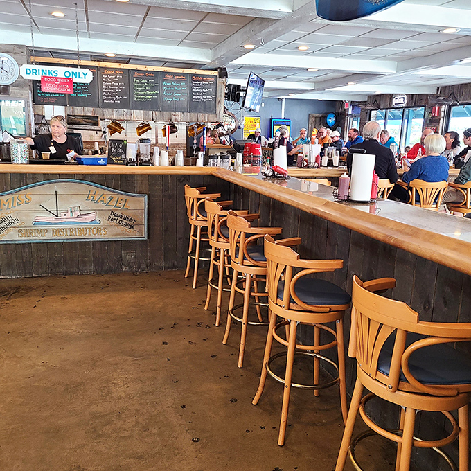 The bar area &ndash; where locals swap fishing tales that grow taller with each round. Wood paneling that's witnessed countless celebrations.