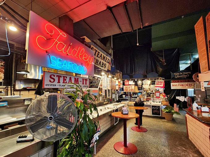 The counter where seafood dreams come true. That neon sign has witnessed countless first-bite expressions of pure joy.