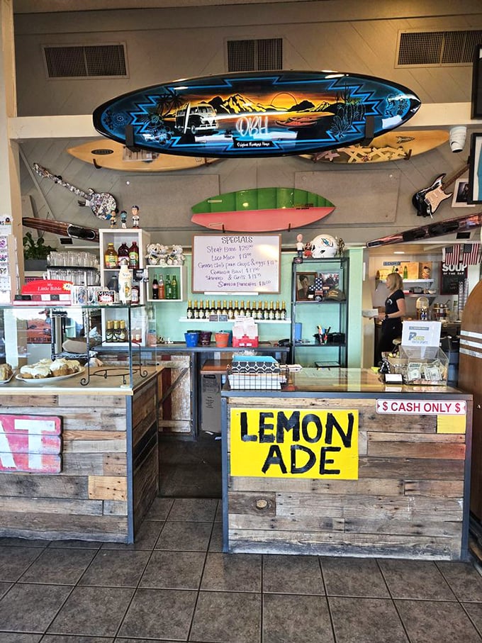 A counter adorned with decorative surfboards and hometown charm, where regulars gather to solve world problems over endless coffee.