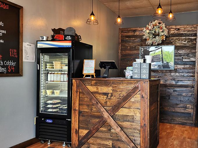 The rustic wooden counter and barn-door aesthetic remind you that great barbecue is where craftsmanship meets tradition.