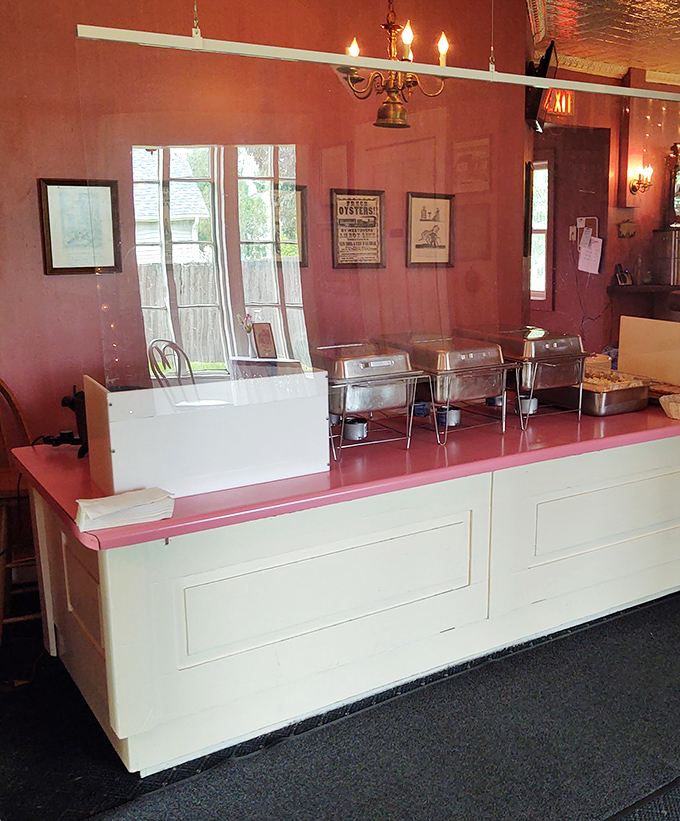 The pink-topped counter area feels like a time machine to simpler days, when dinner out was an occasion and chafing dishes promised abundance.