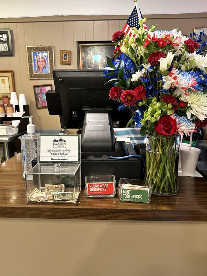 Classic counter seating on vintage orange stools where solo diners can watch the breakfast magic happen up close.