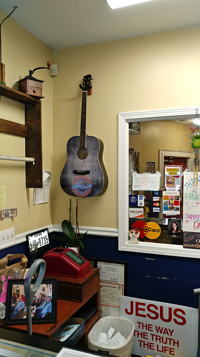 A guitar on the wall and vintage cash register—little touches that tell you this place has stories to share between bites.