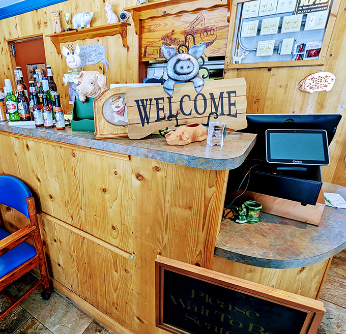The welcome counter says it all&mdash;pig-themed decor, rustic wood, and the promise of hospitality that feels genuinely Floridian rather than tourist-manufactured.