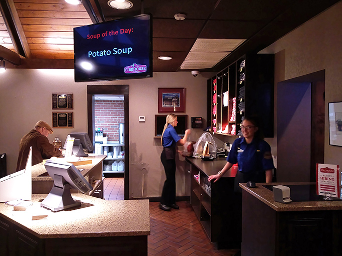 The counter area showcases the restaurant's commitment to preserving the building's character while creating a welcoming space for barbecue pilgrims.
