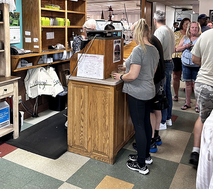 The counter where hopeful diners wait their turn, eyeing the dining room like kids outside a candy store.