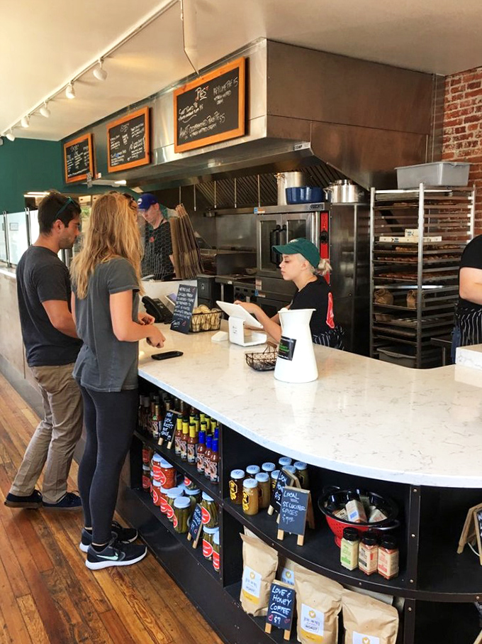 Where the magic happens&mdash;customers eagerly placing orders while staff orchestrates the delicious dance of frying, assembling, and serving that keeps the line moving.