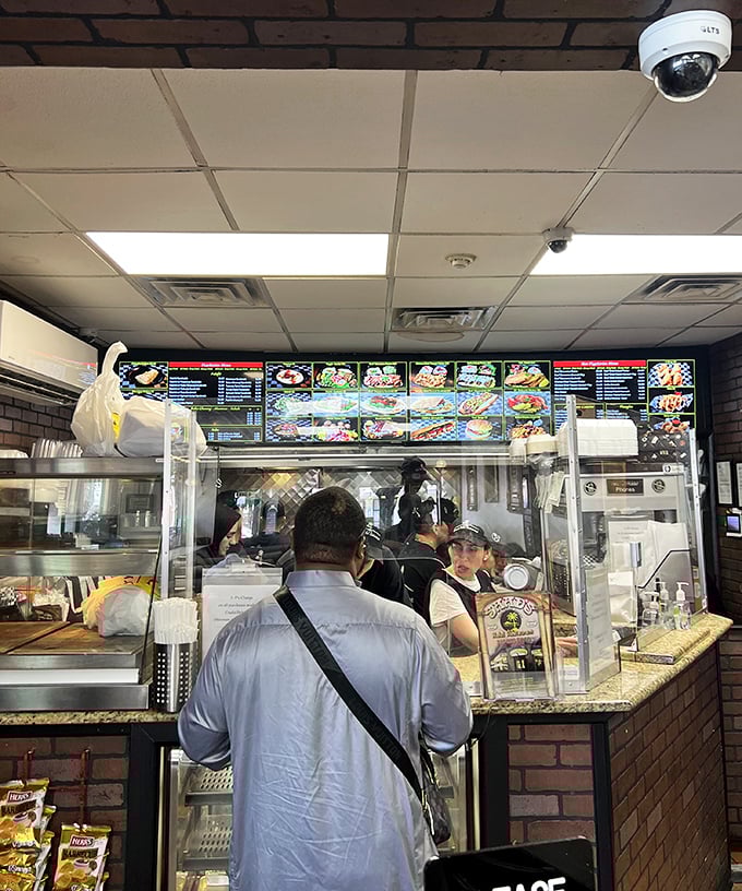 At the counter, where culinary magic happens, staff efficiently transform simple ingredients into dishes that make you question why you ever eat anywhere else.