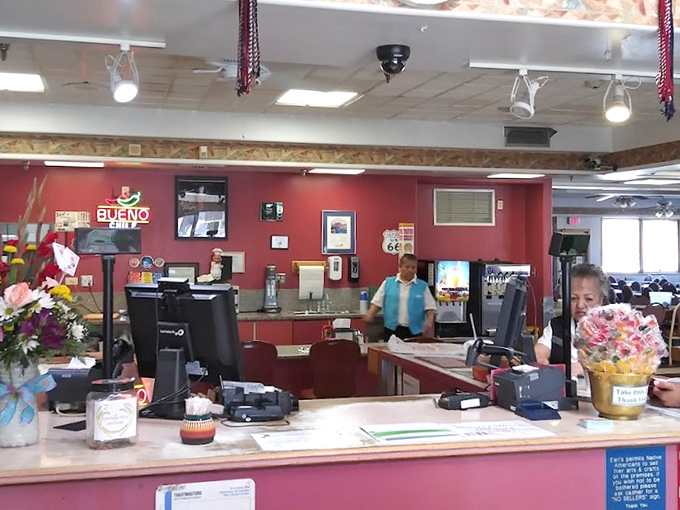 The bustling counter where magic happens&mdash;coffee flows freely and orders fly while Route 66 memorabilia watches from above.