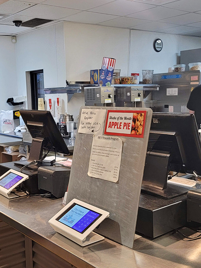 The "Shake of the Month" sign tempts with seasonal creativity – Apple Pie flavor that drinks like dessert.