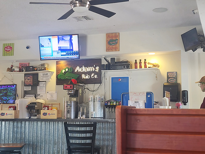 The counter where barbecue dreams come true. That corrugated metal isn't trendy design&mdash;it's practical, just like the food.
