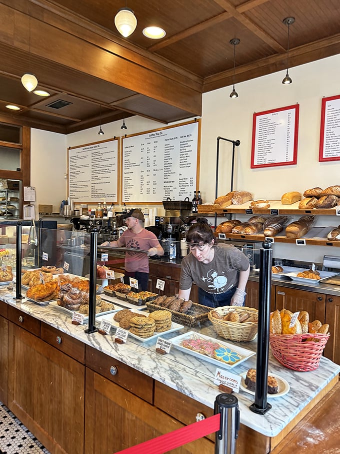 Behind this counter, bakers perform the daily miracle of turning flour, water, and butter into reasons to get out of bed.