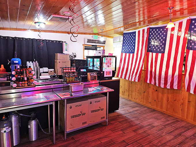 The ordering counter: where dreams are made and calories cease to matter. American flags remind you this is patriotic eating.