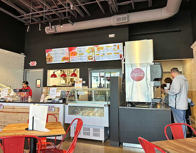 The ordering counter &ndash; where dreams of Nashville heat begin. Clean lines, efficient design, and menu boards that make decision-making deliciously difficult.