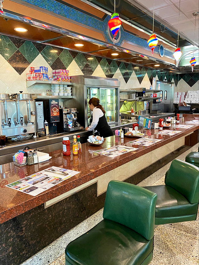 The counter&mdash;where solo diners find community, coffee achieves immortality, and servers perform the ballet of breakfast with practiced grace.