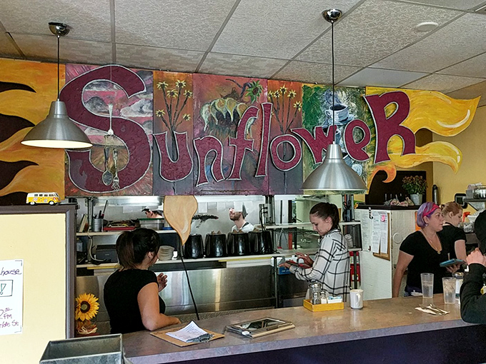 The vibrant "Sunflower" mural watches over the kitchen like a colorful guardian angel of breakfast, setting the tone for creative morning feasting.