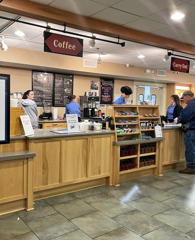 The coffee counter serves as command central for caffeine needs, where friendly staff prepare liquid fuel for your ambitious buffet strategy.