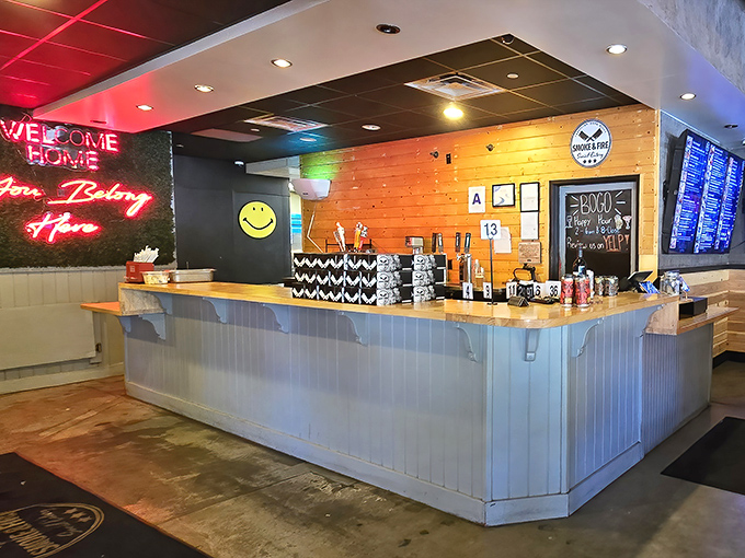 The counter where barbecue dreams come true, complete with a neon "Welcome Home" sign that somehow feels exactly right.