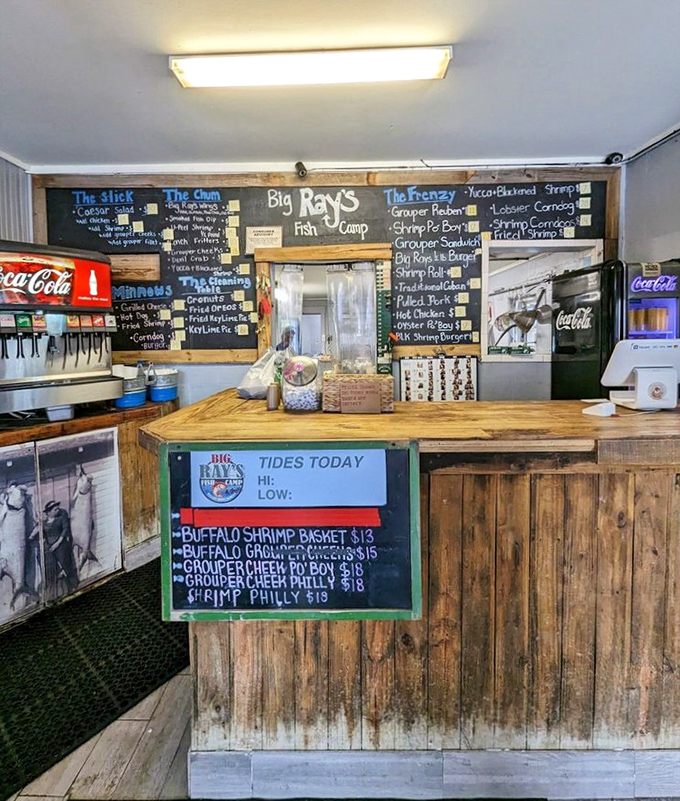 The ordering counter: where dreams become reality. Notice the tide times posted&mdash;because fresh fish and good timing go hand in hand.