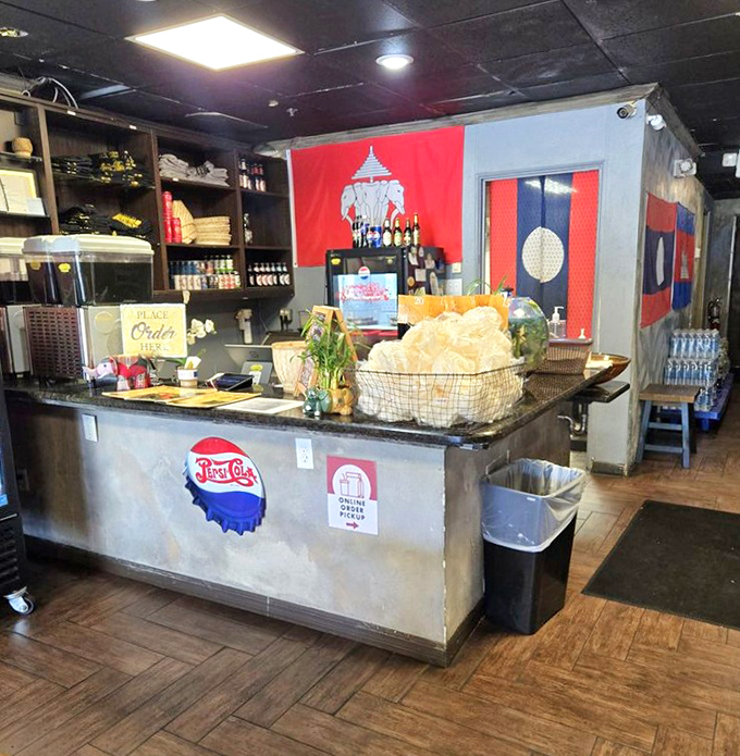 The counter area showcases Laotian flags and cultural touches that transport you thousands of miles while staying in Orlando.