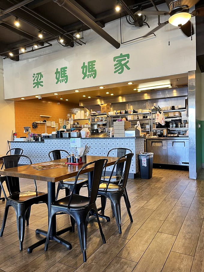 The open kitchen design lets you witness the magic happening behind that iconic green signage. Food theater at its finest!