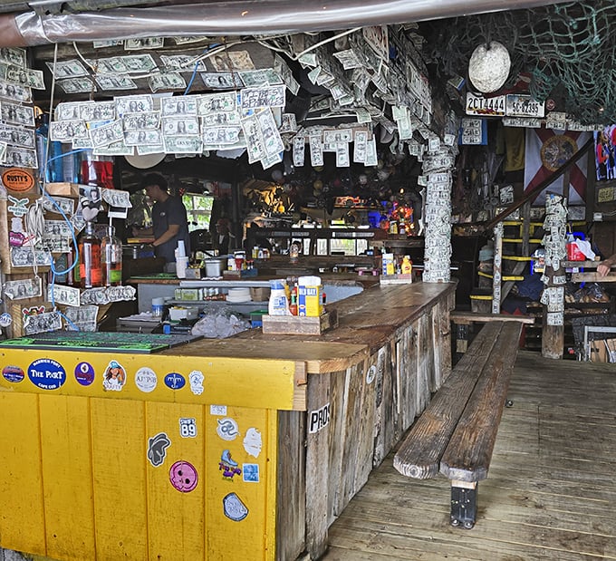 Dollar bills papering the ceiling and walls aren't just decoration&mdash;they're testimonials from satisfied customers who left their mark on this beloved institution. 