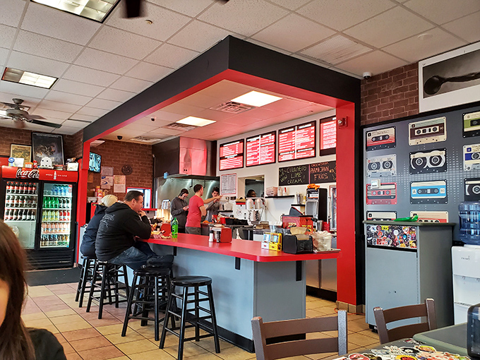 The counter isn't just where orders happen&mdash;it's where burger dreams begin. Those red menu boards aren't lists; they're promises of happiness.
