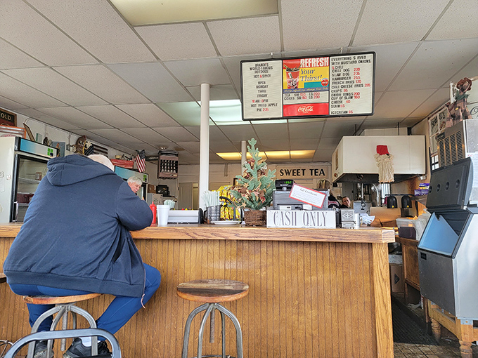The counter area where magic happens, complete with the "CASH ONLY" sign that separates the prepared from the unprepared.