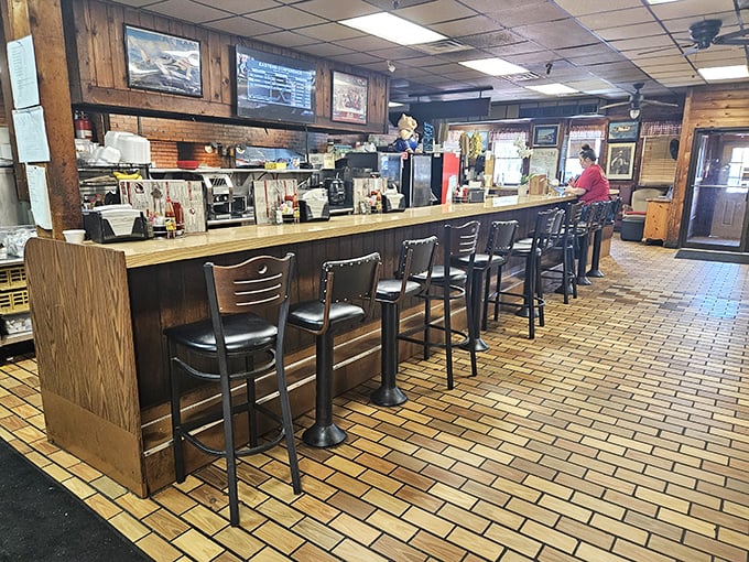 The counter where magic happens. Pull up a stool, watch the kitchen ballet, and prepare for a meal that's been perfected over decades.