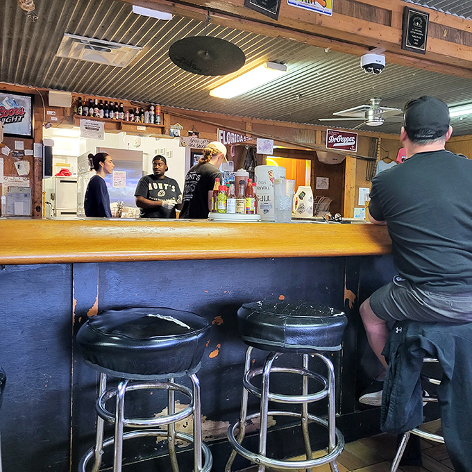 The counter seats offer front-row views to the seafood show, where oyster shuckers perform their craft with the precision of surgeons.