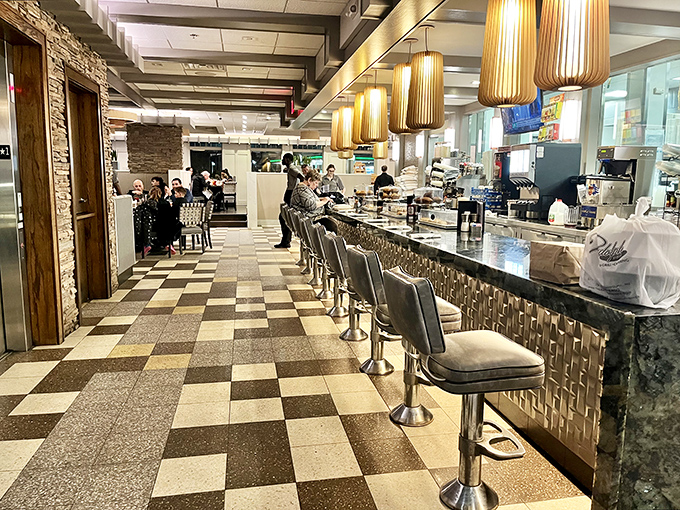 Counter seating: where solo diners become regulars and the coffee refills flow like conversation with your favorite server.